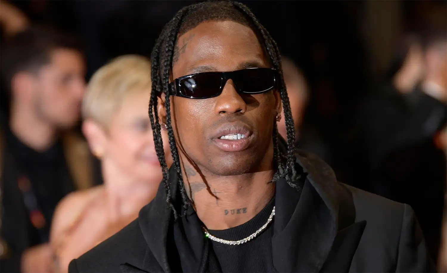 The Curious Case of Travis Scott: A Rapper's Guide to Rhyme and Rhinoplasty